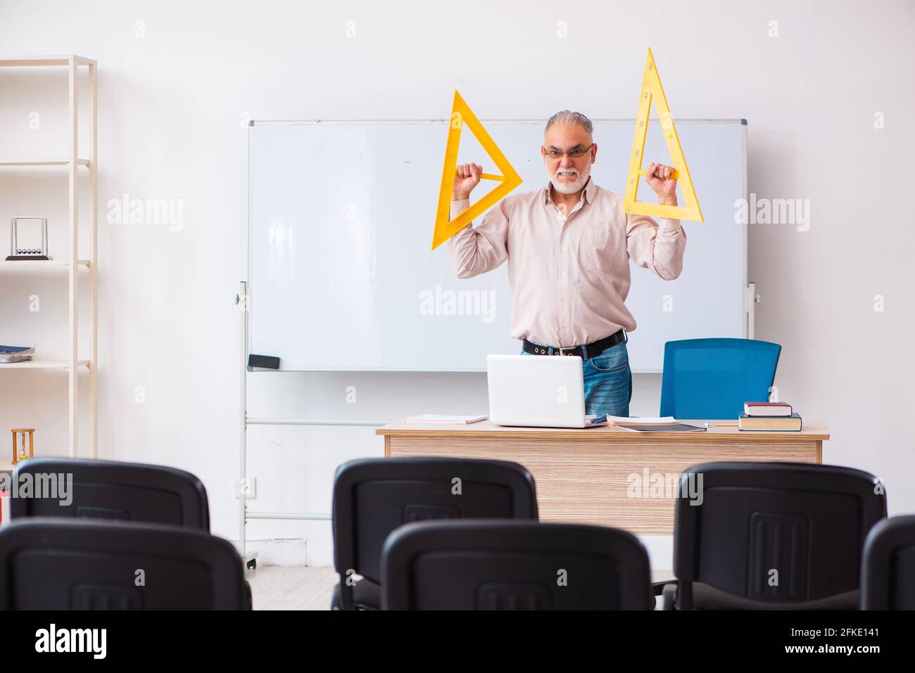 Angry teacher and ruler hi-res stock photography and images - Alamy