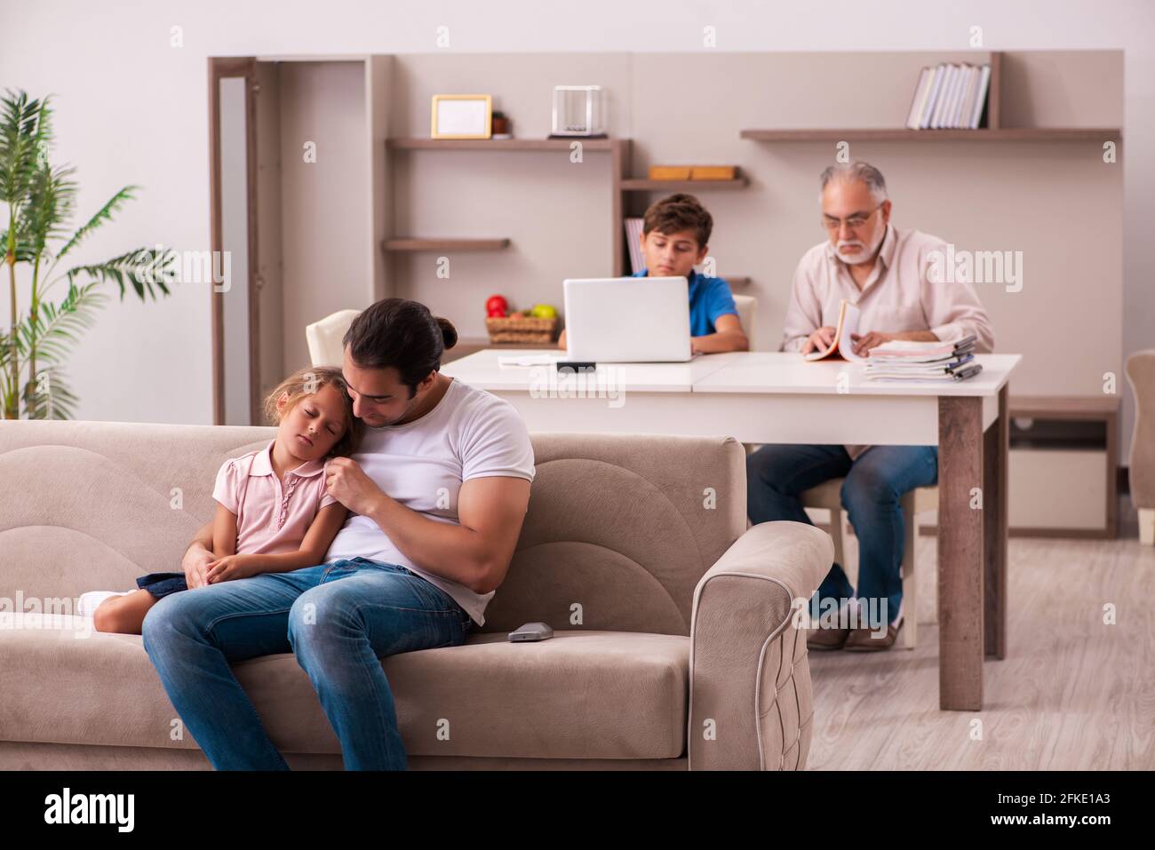 Three generations at home in early development concept Stock Photo - Alamy