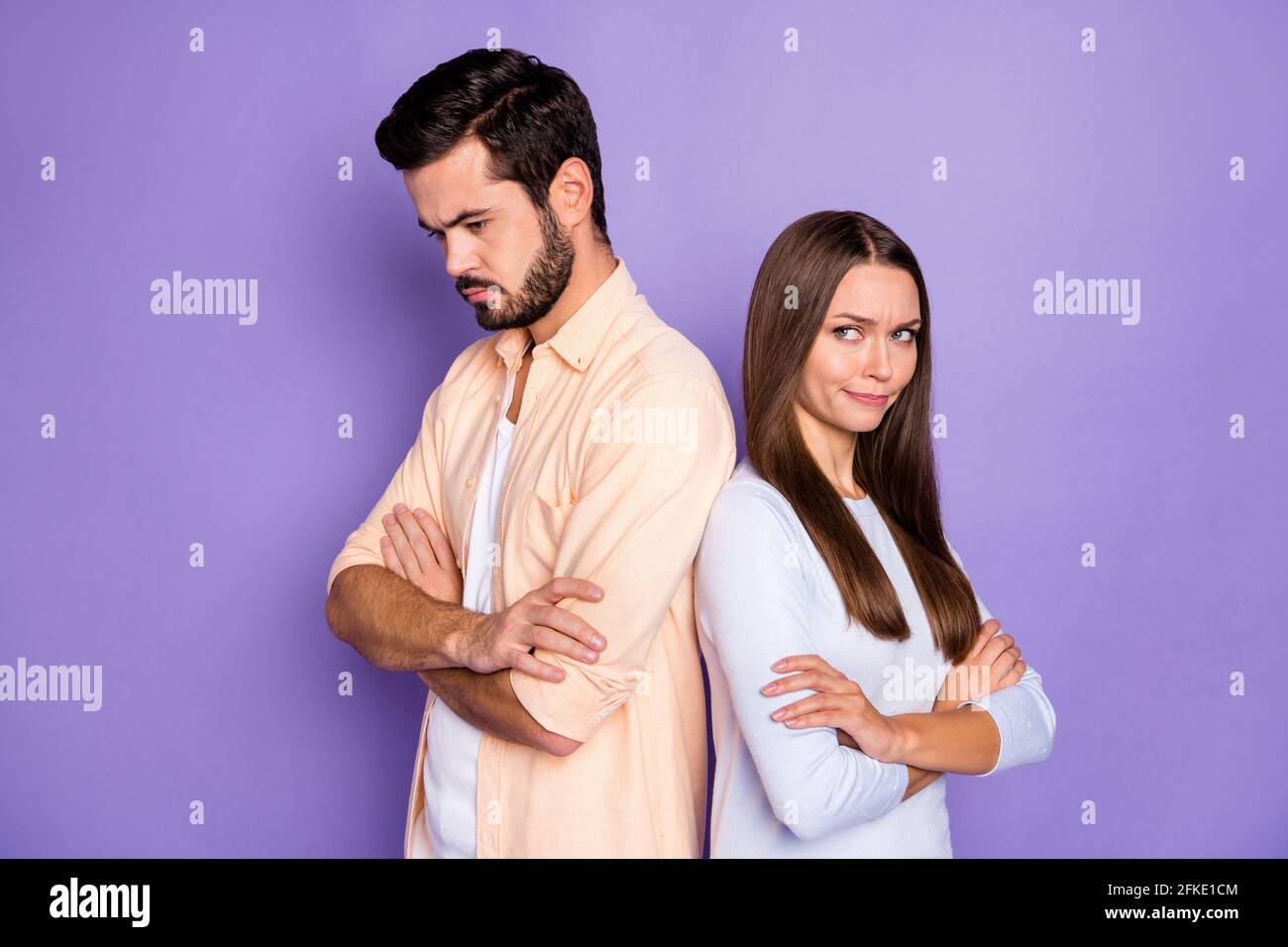 Photo of unhappy couple guilty woman sad man folded hands stand back to ...