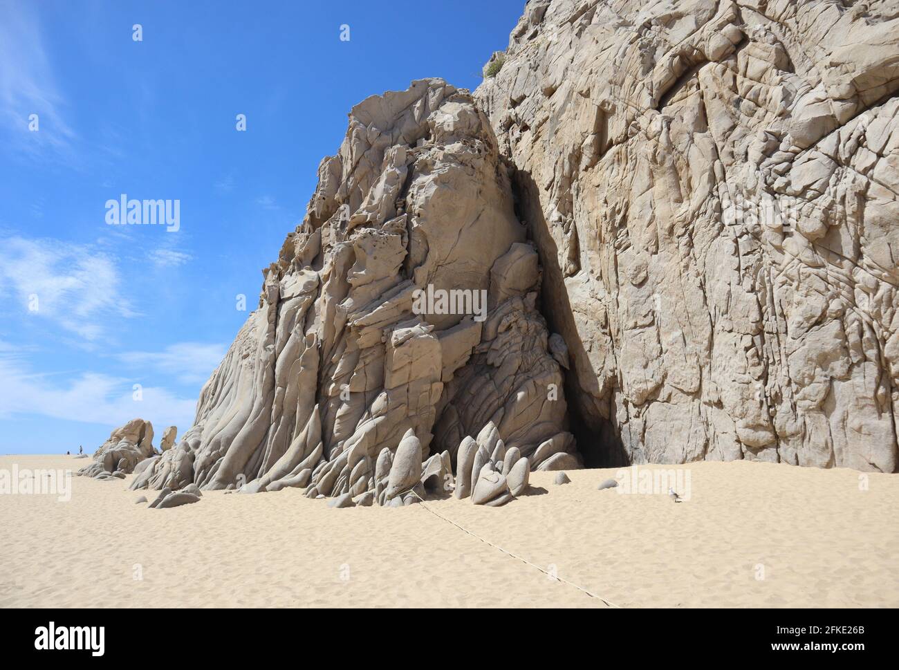 Pacific ocean and beach with golden sands and limestone rock formations ...