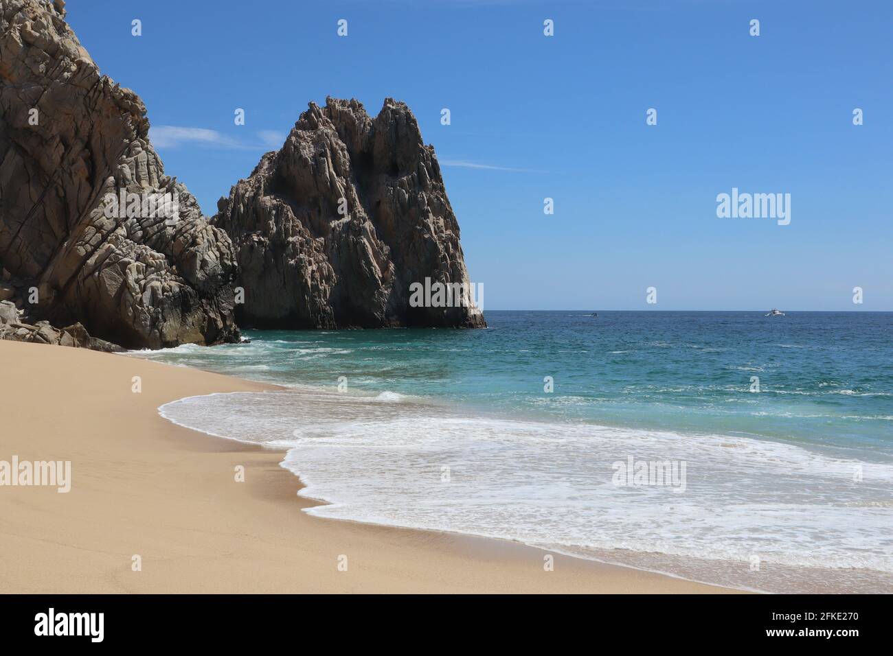 Pacific ocean and beach with golden sands and limestone rock formations ...