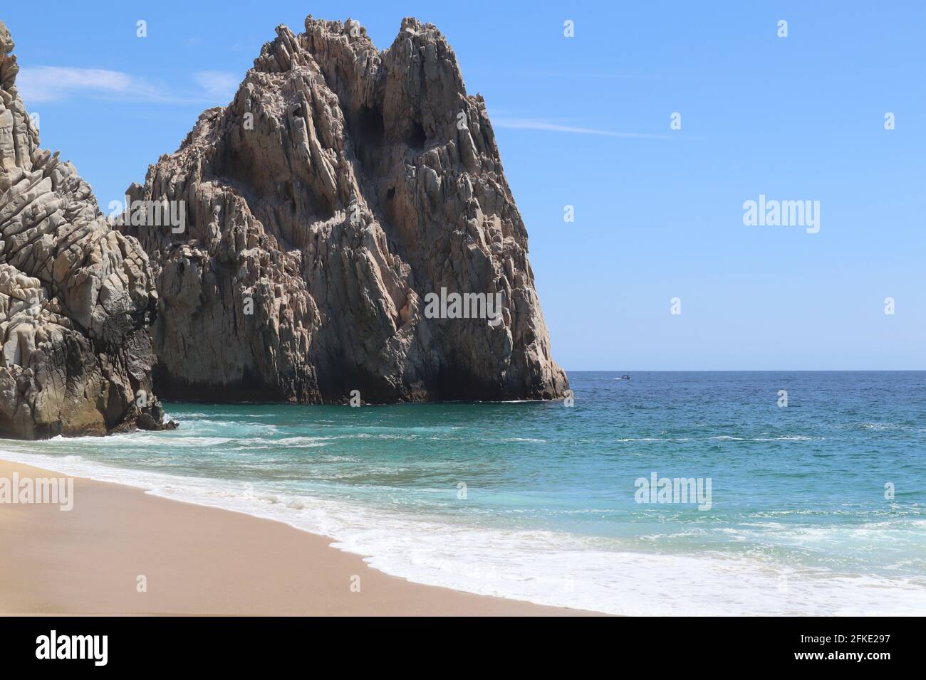 Pacific ocean and beach with golden sands and limestone rock formations ...