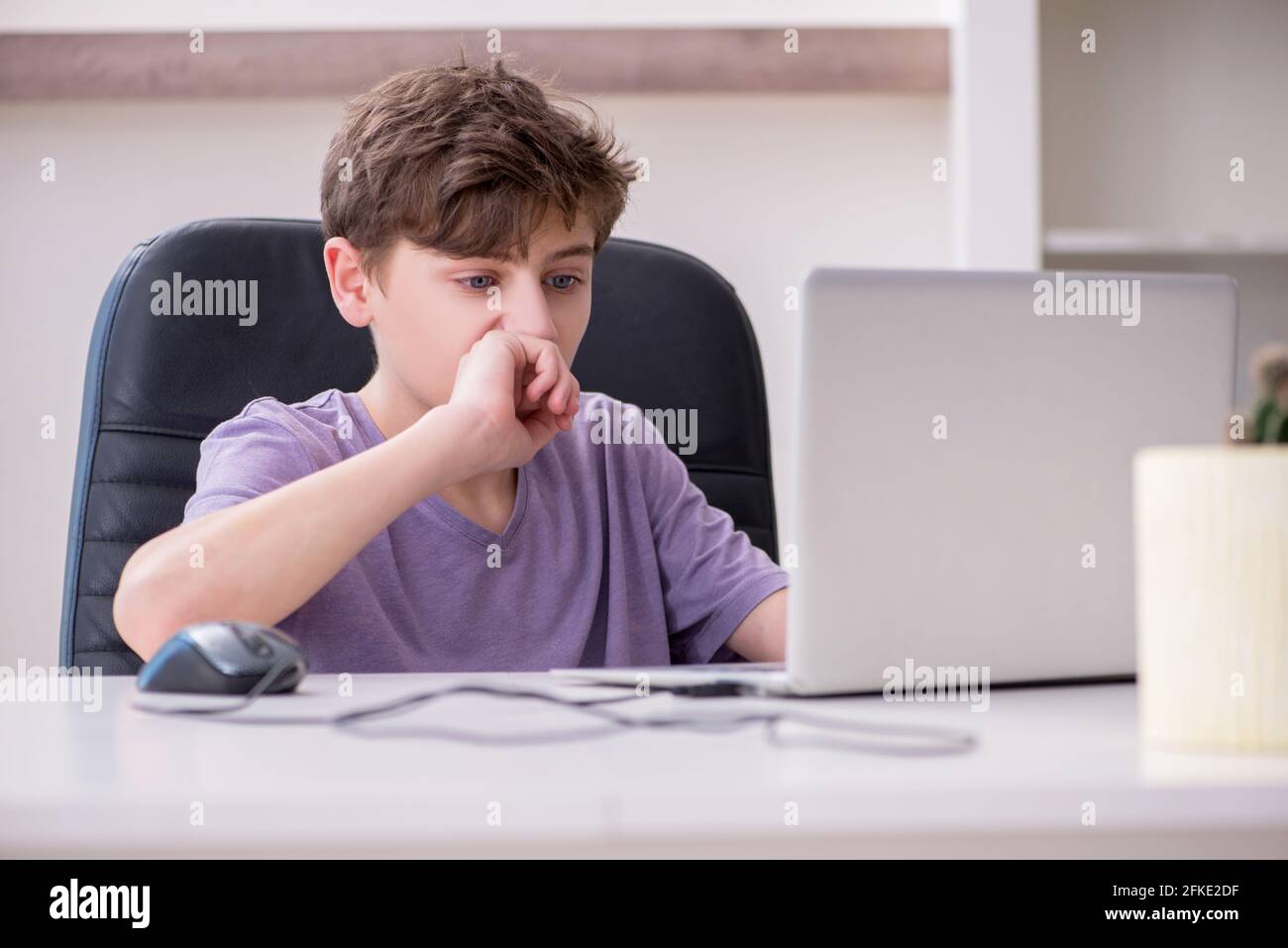 Boy playing computer games at home Stock Photo - Alamy