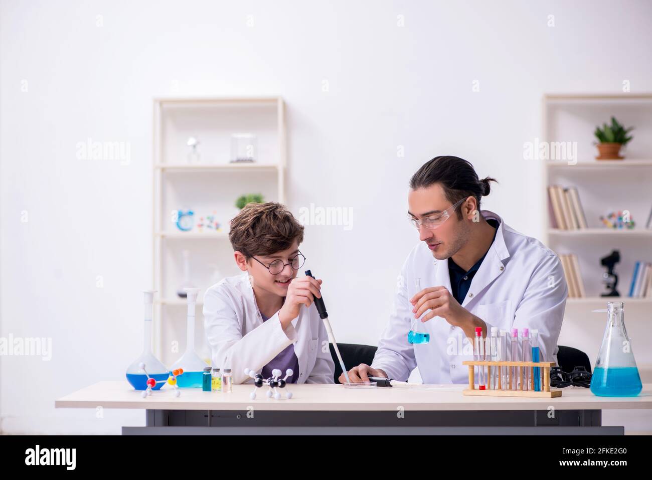 Young father and son chemists in the laboratory Stock Photo - Alamy