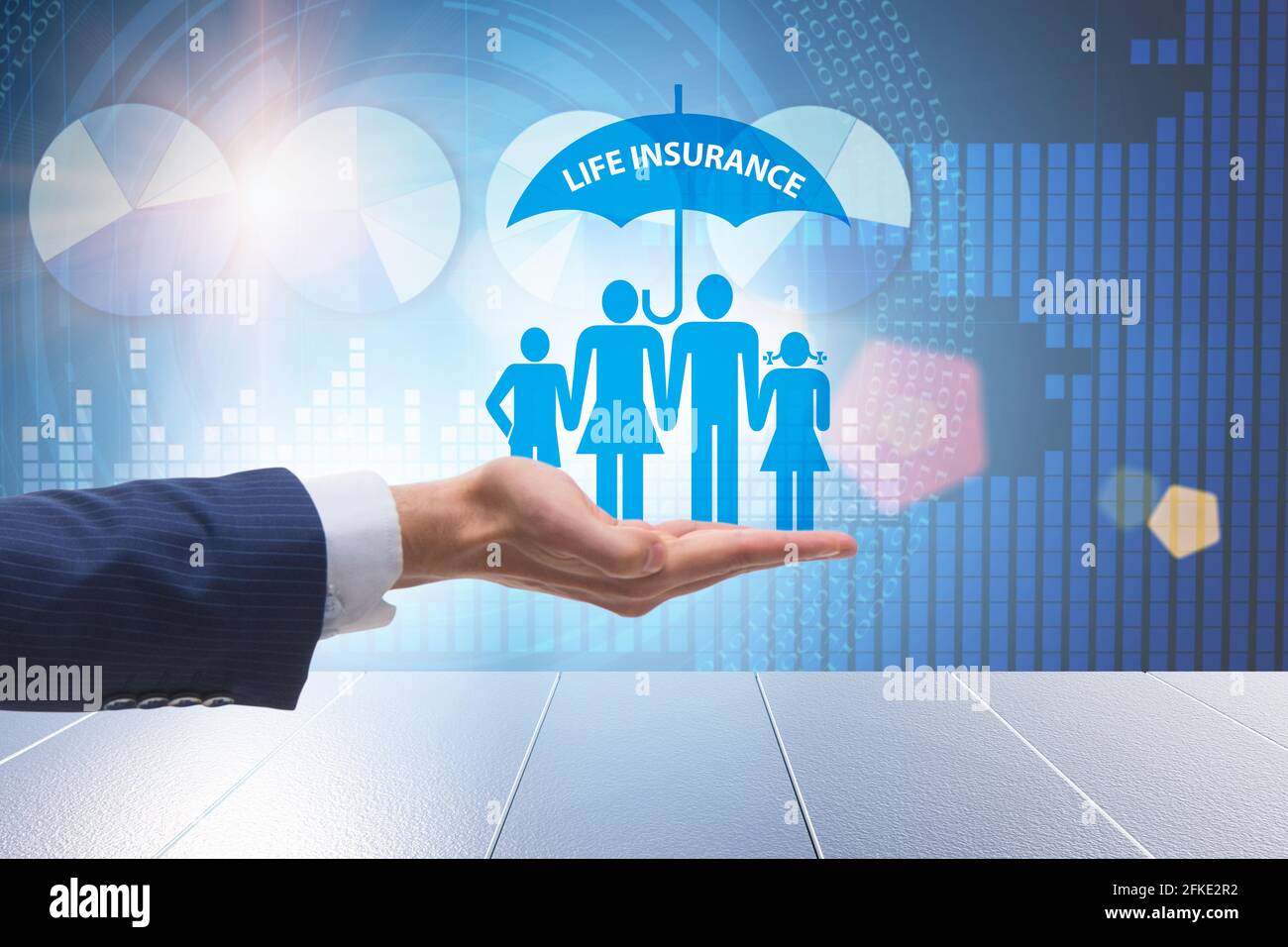 Life insurance concept with family under the umbrella Stock Photo - Alamy