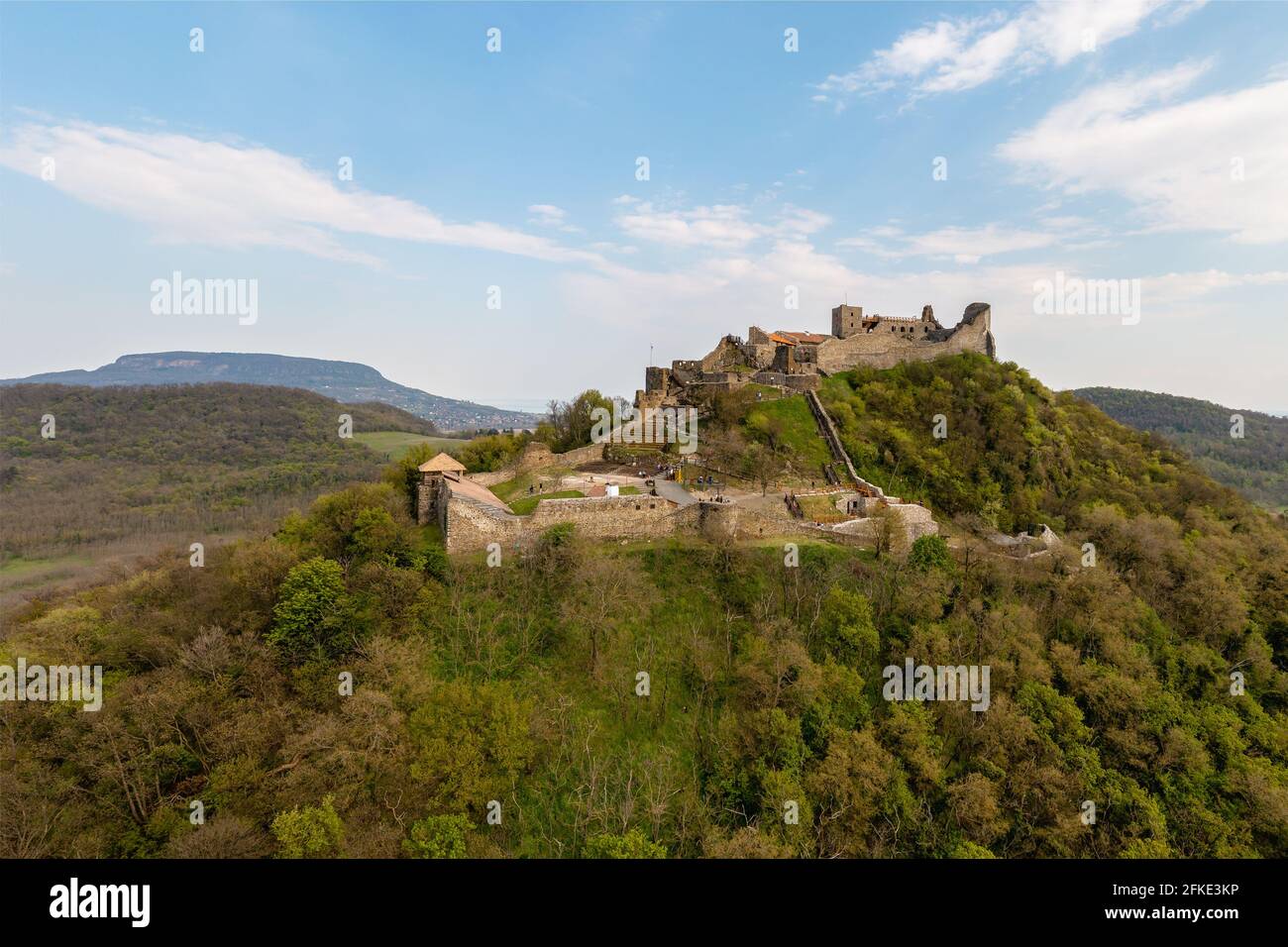The Castle of Szigliget with Badacsony mountain next to lake Balaton in ...