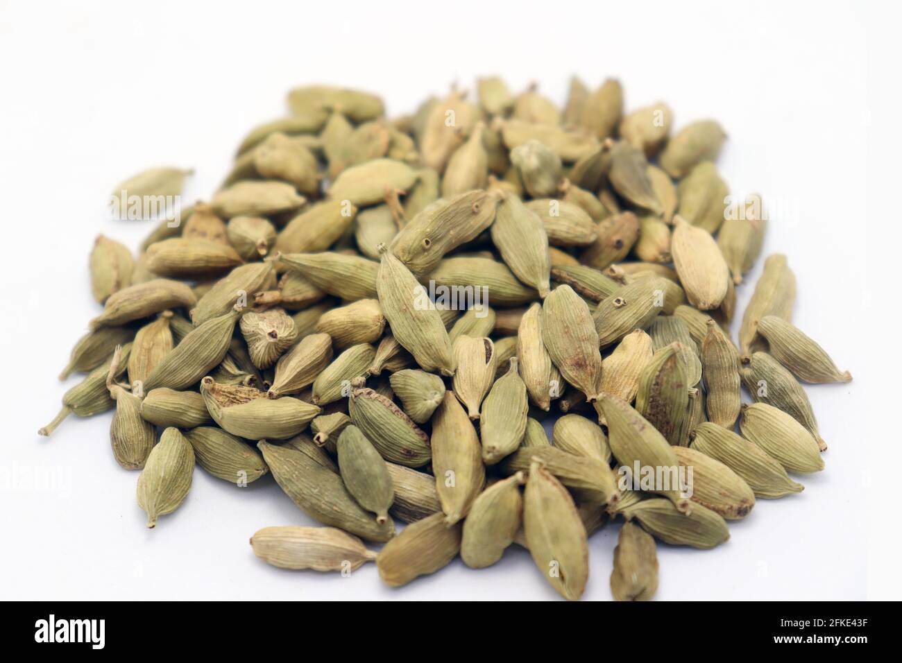 healthy and spicy Green Cardamom stock on white background Stock Photo ...