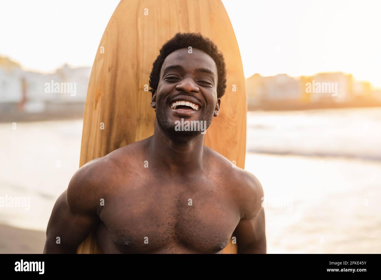 Happy afro surfer having fun surfing during sunset time - African man ...
