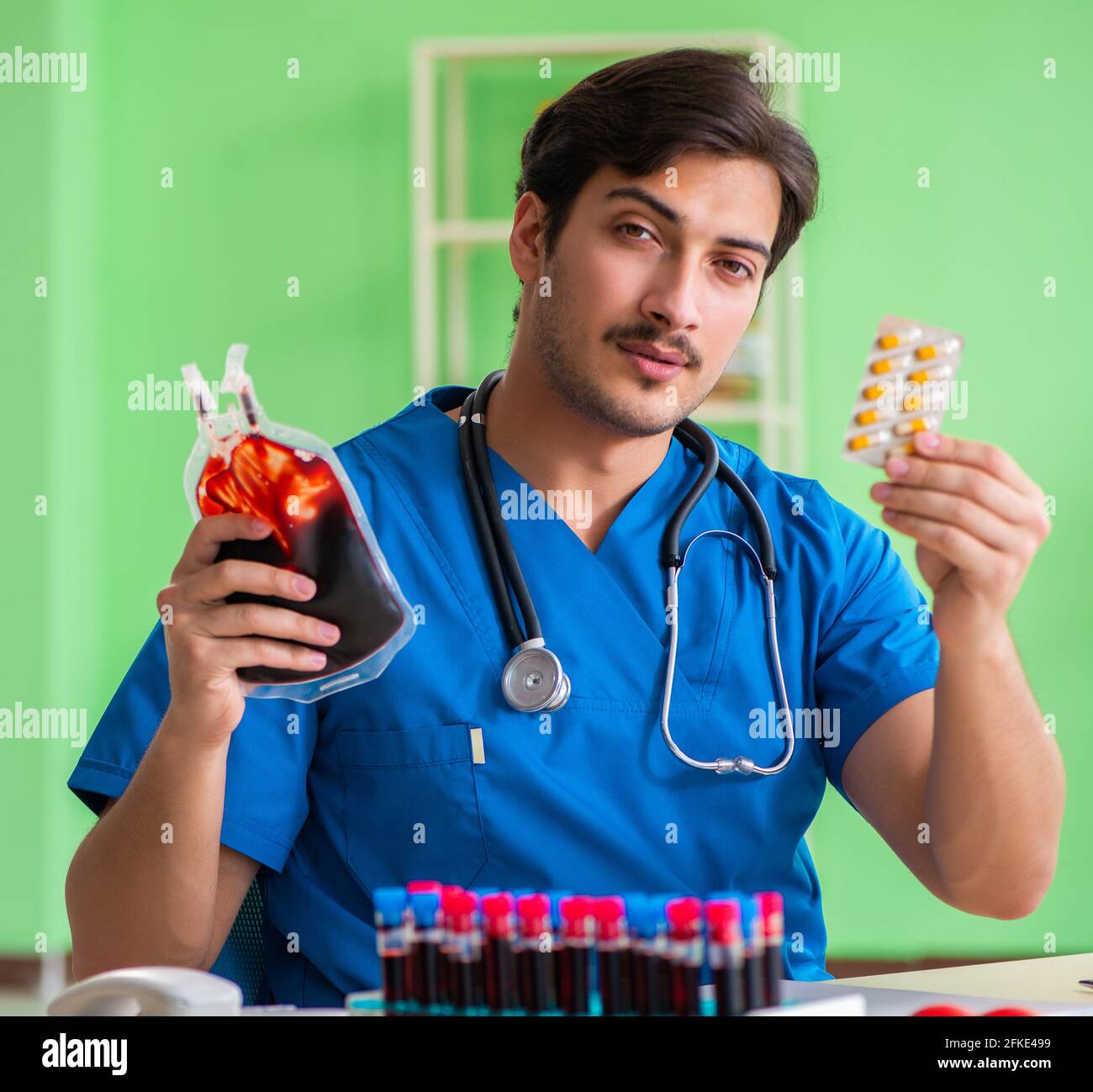 The doctor doing blood analysis in the lab Stock Photo - Alamy