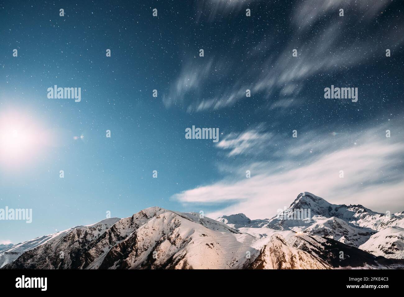 Stepantsminda, Georgia. Moonrise In Winter Night Starry Sky With ...