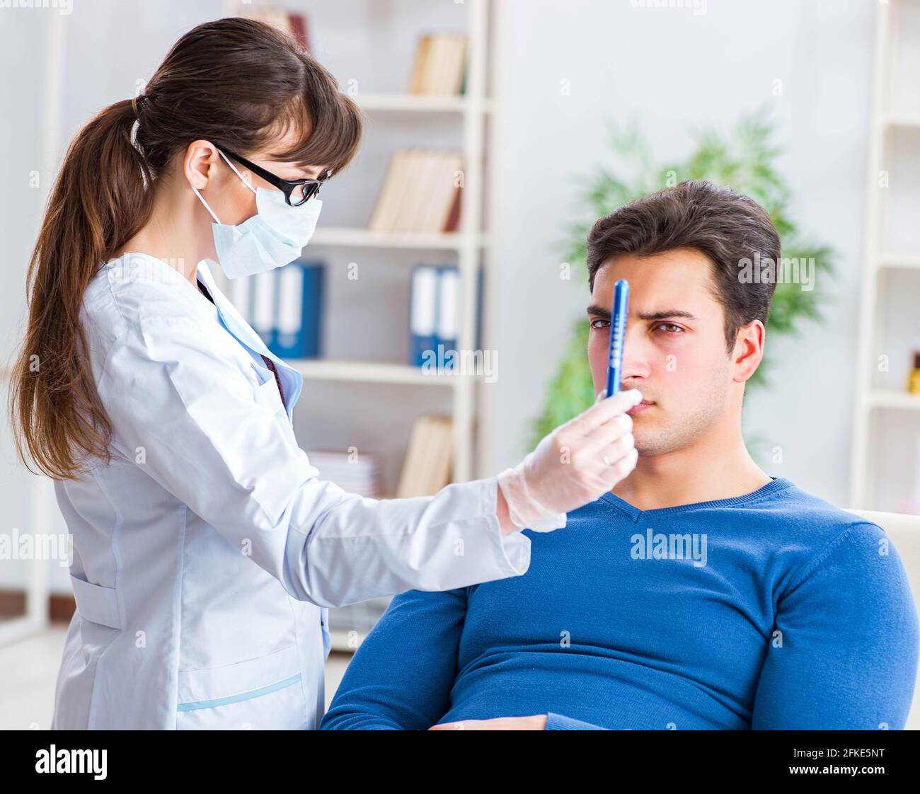 The doctor checking up patient in first aid concept Stock Photo - Alamy