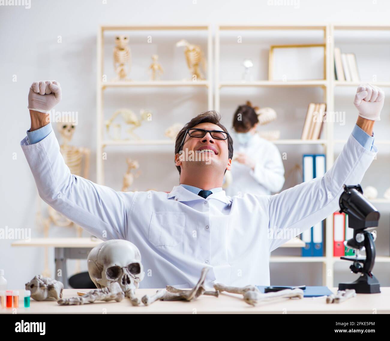 The professor studying human skeleton in lab Stock Photo - Alamy