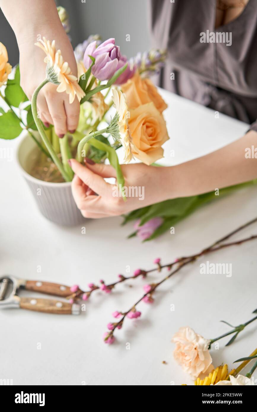 Step by step installation of flowers in a vase. Flowers bunch, set for ...