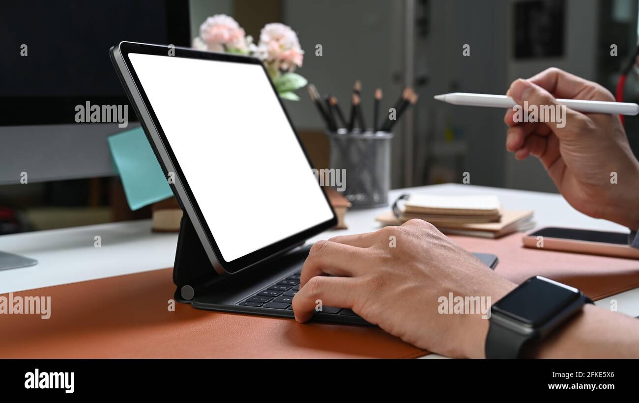 Close up view hands of businessman with smart watch holding stylus pen ...