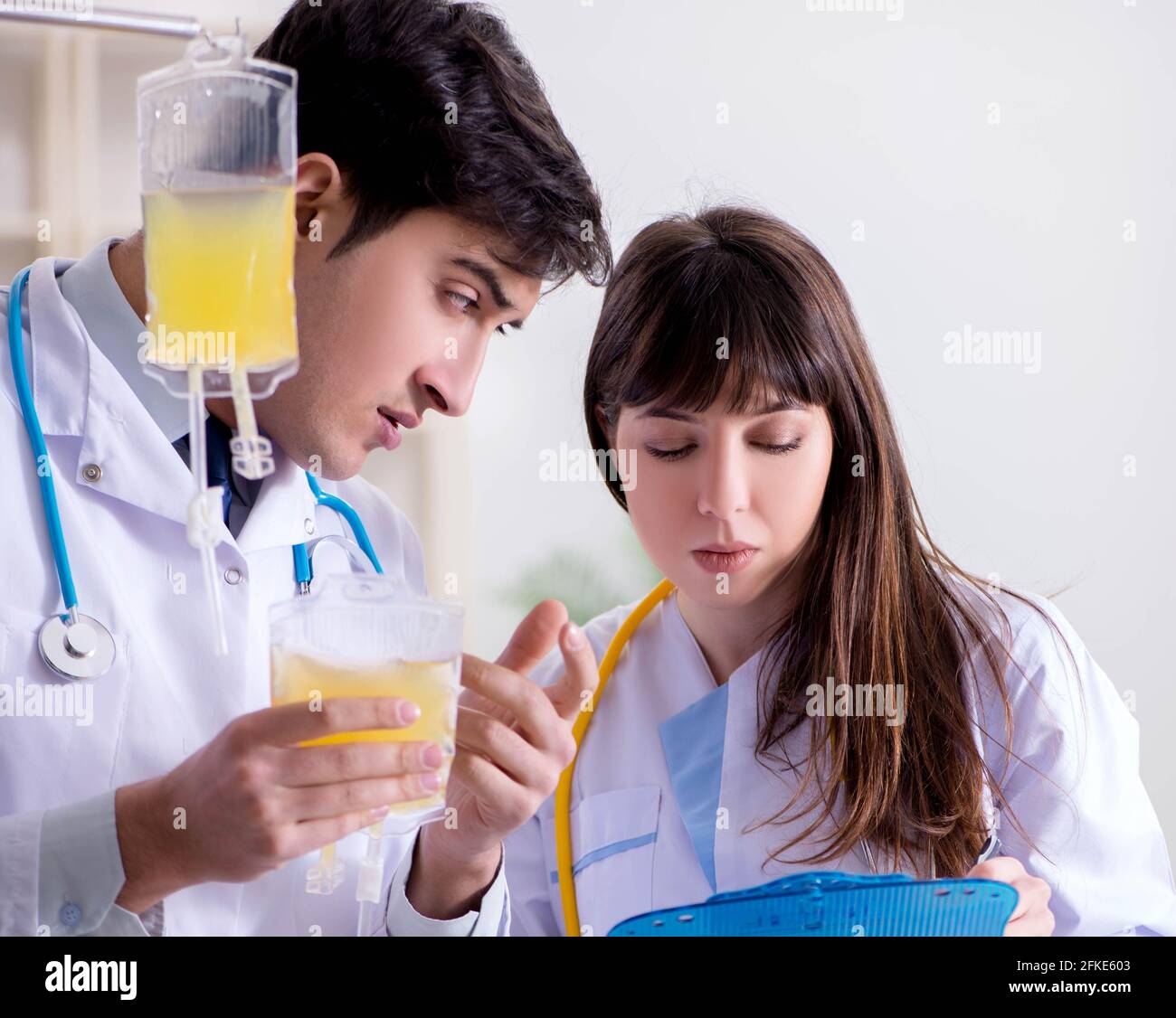 The two doctors discussing plasma and blood transfusion Stock Photo - Alamy