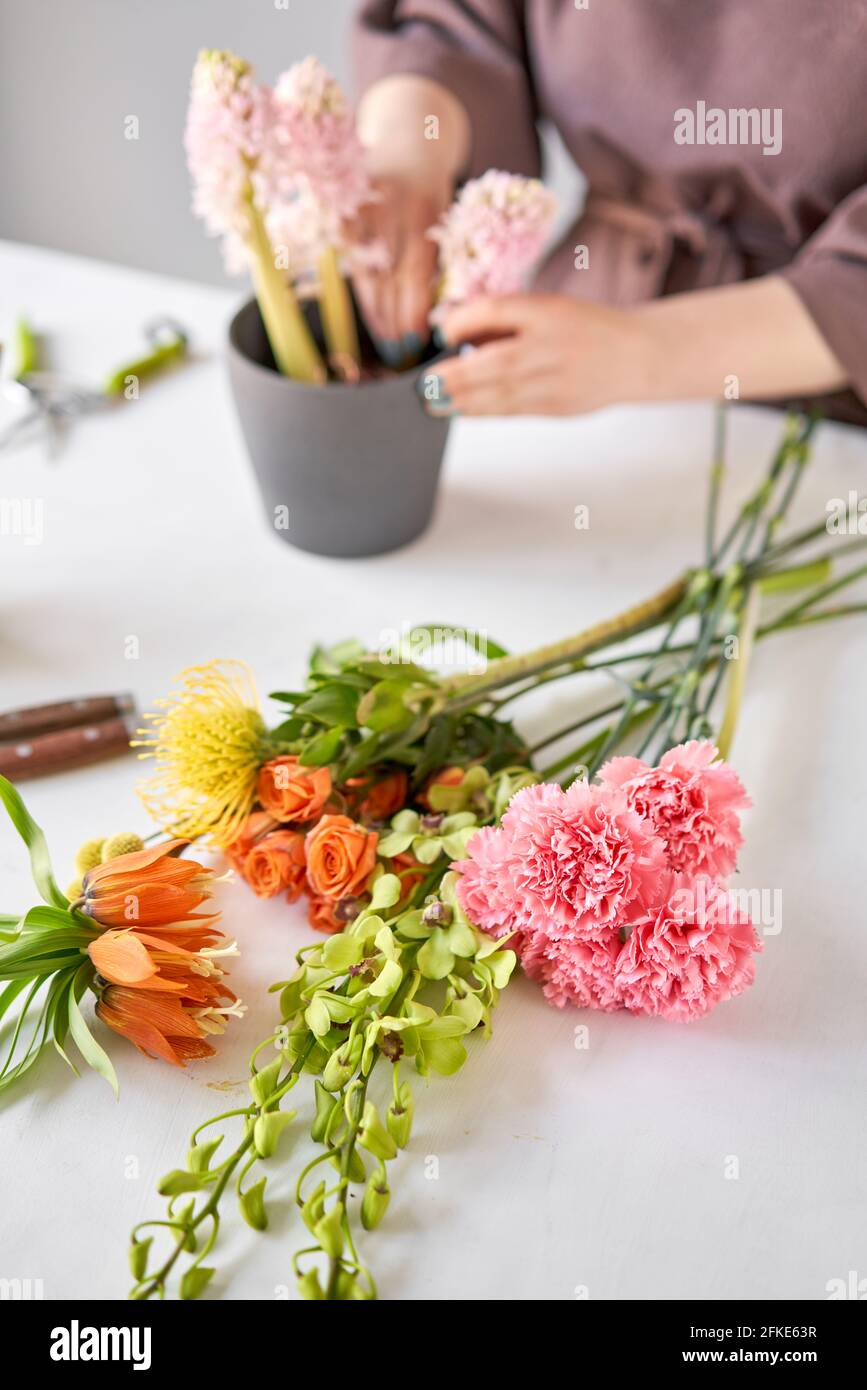 Step by step installation of flowers in a vase. Flowers bunch, set for ...
