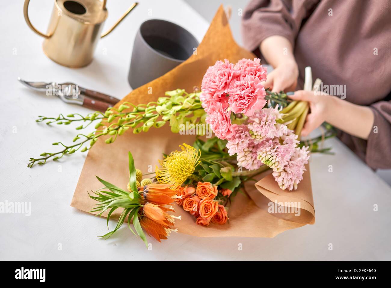 Unpacking Flowers bunch, set for home. Fresh cut flowers for decoration ...