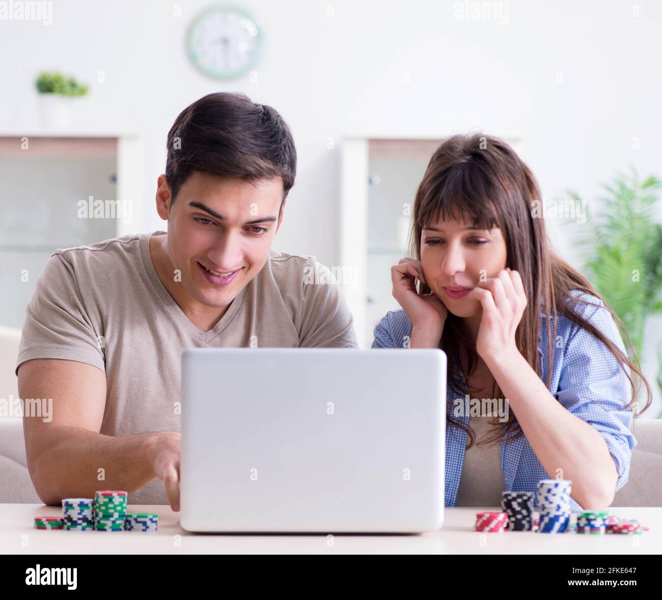 The family of wife and husband gambling online Stock Photo - Alamy