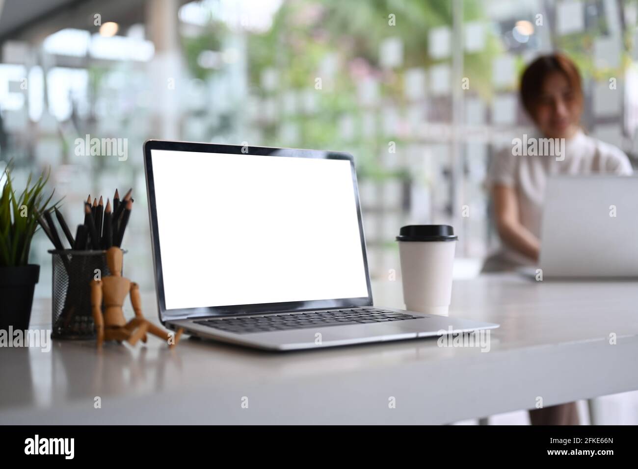 Close up view computer laptop with blank screen on white office desk ...