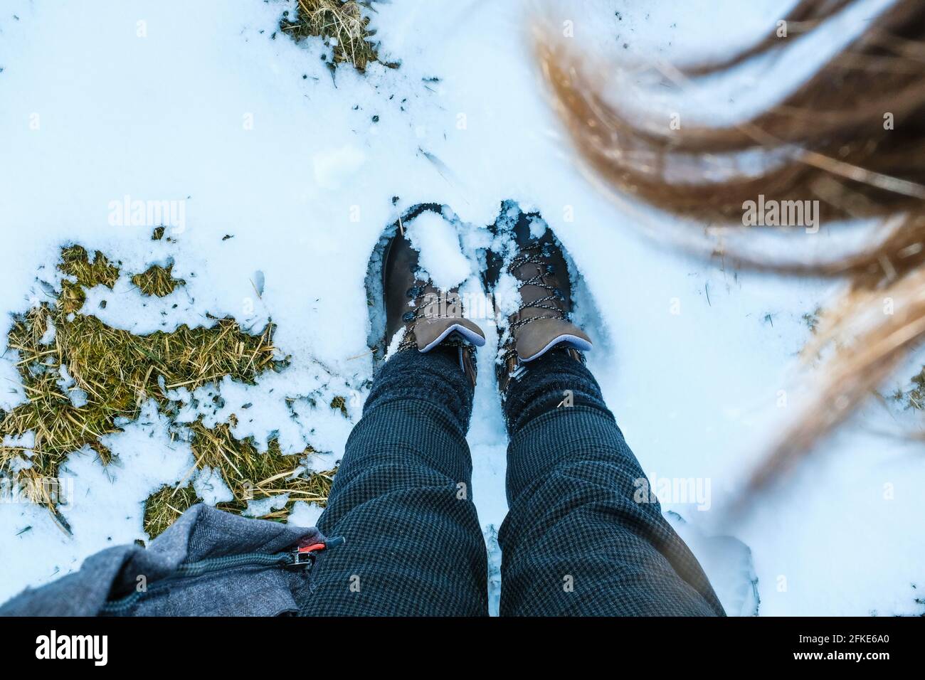 Women in walking boots in the snow Stock Photo - Alamy
