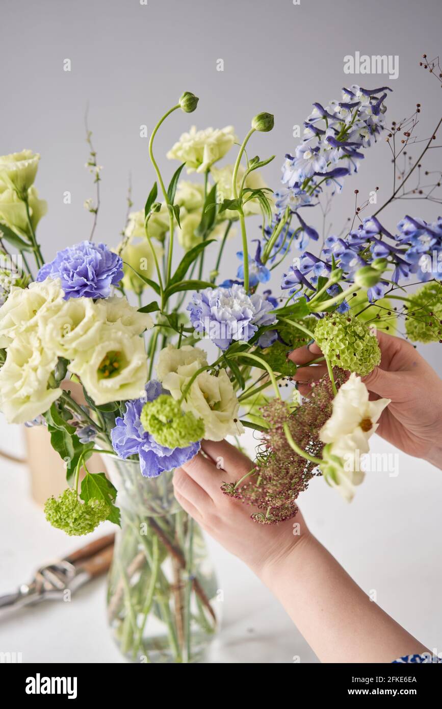 Step by step installation of flowers in a vase. Flowers bunch, set for ...