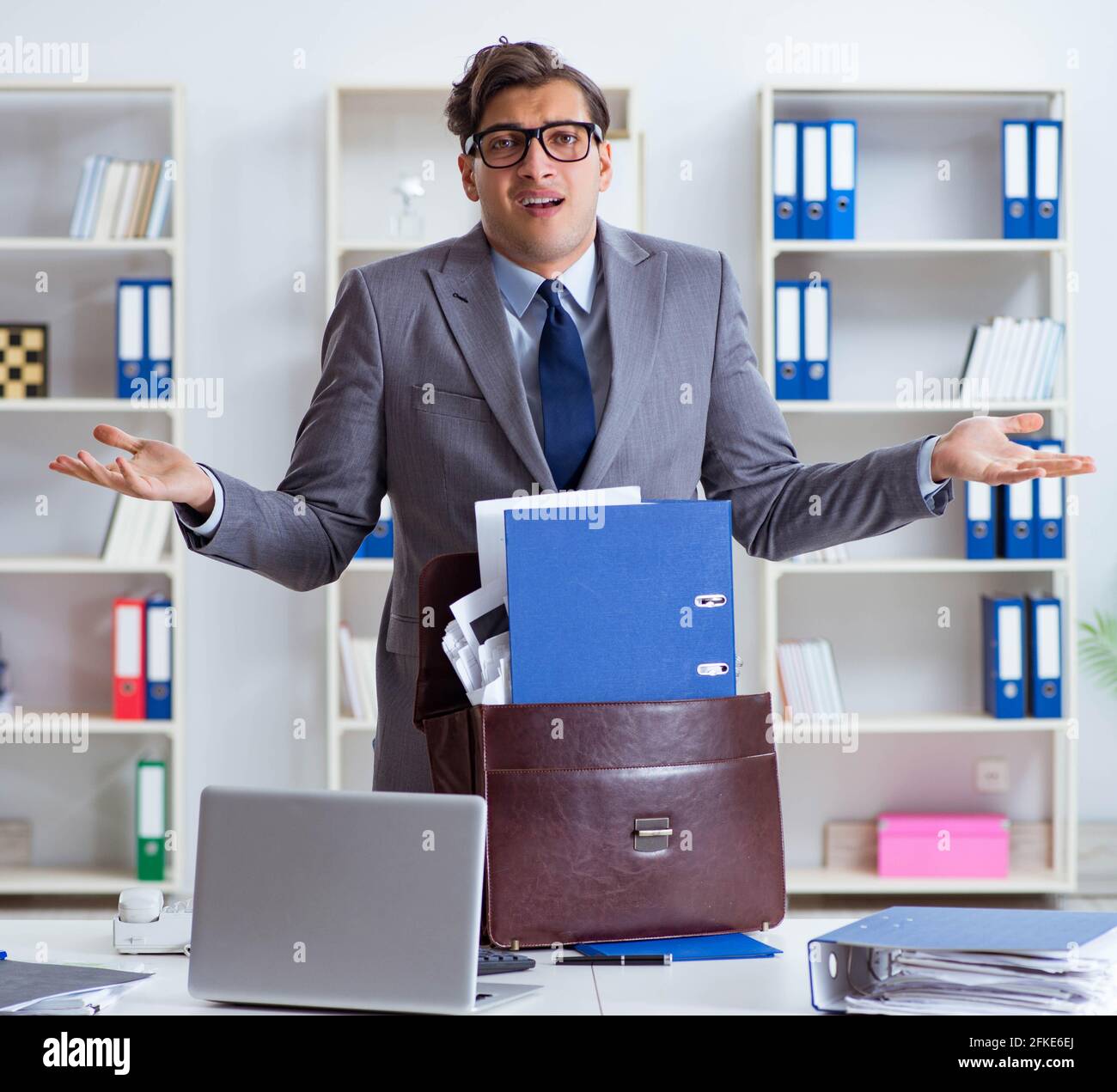 The employee with too much work taking it home Stock Photo - Alamy