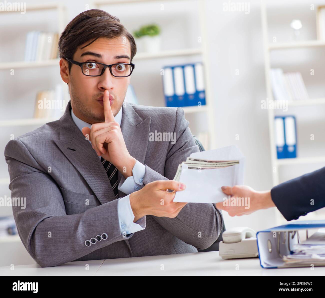 Businessman handing envelope hi-res stock photography and images - Alamy