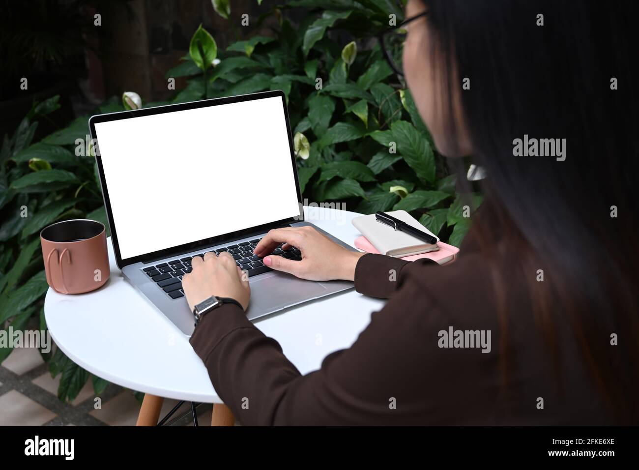 Over shoulder view of businesswoman working with computer laptop at ...