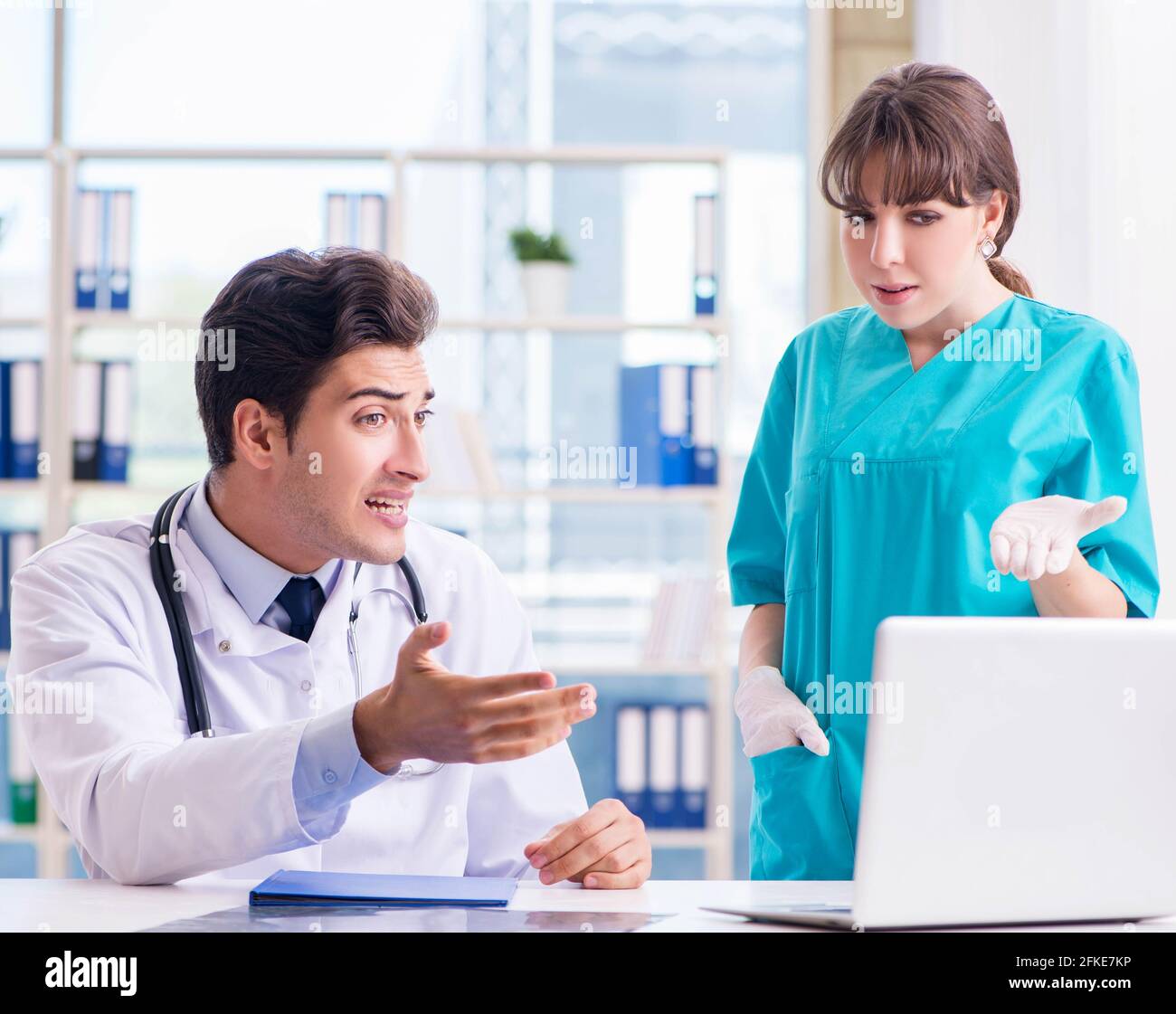 The doctor angry at his assistant due to medical error Stock Photo - Alamy