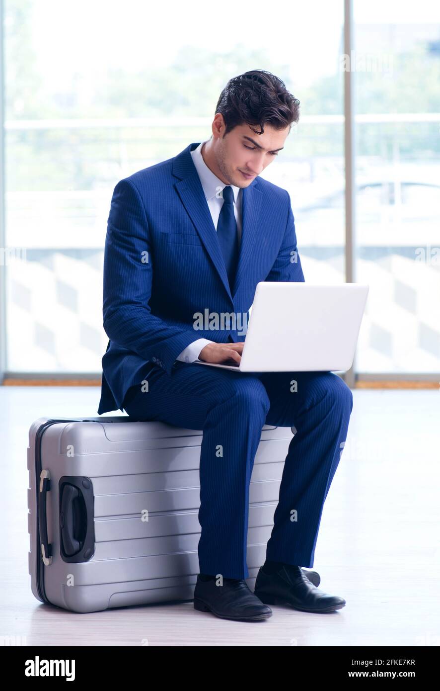 The businessman waiting for his flight at airport Stock Photo - Alamy