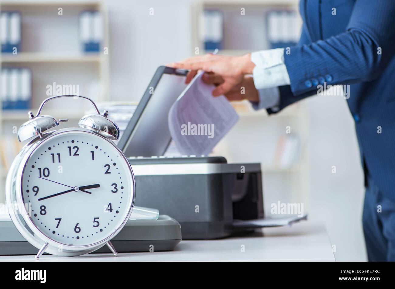 The businessman making copies in copying machine Stock Photo - Alamy