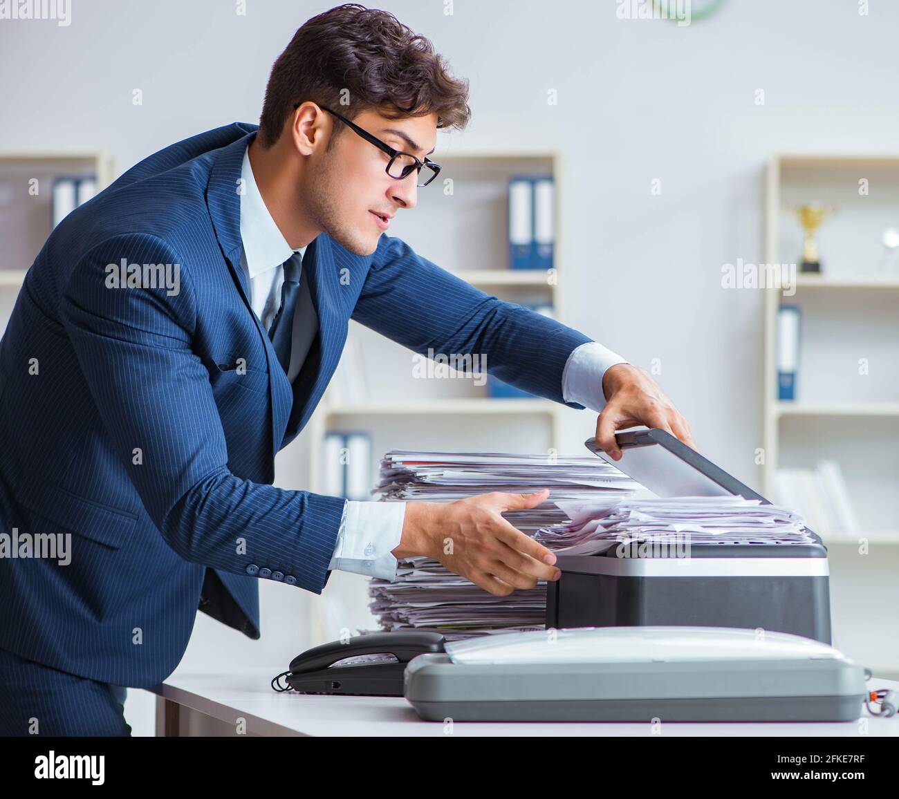 The businessman making copies in copying machine Stock Photo - Alamy