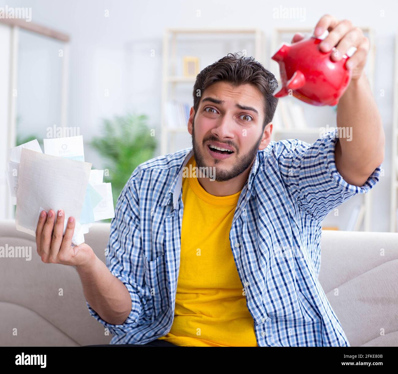 The man angry at bills he needs to pay Stock Photo - Alamy