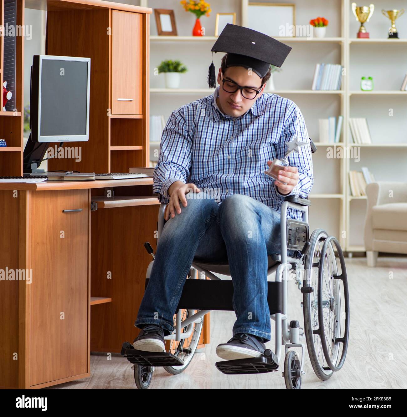 The disabled student studying at home on wheelchair Stock Photo - Alamy