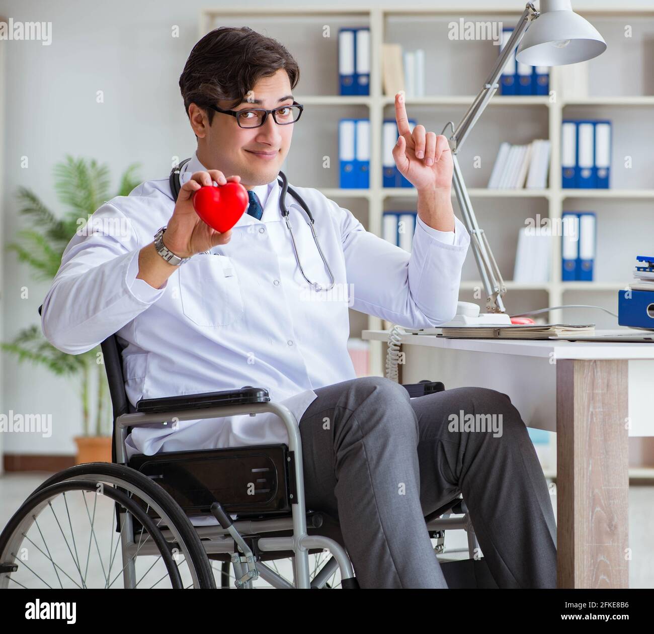The disabled doctor on wheelchair working in hospital Stock Photo - Alamy