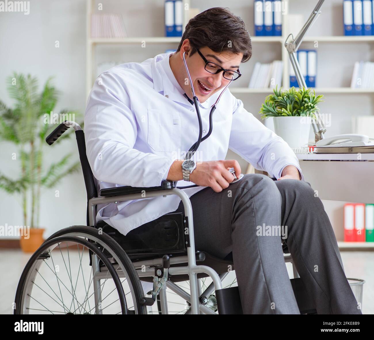 The disabled doctor on wheelchair working in hospital Stock Photo - Alamy