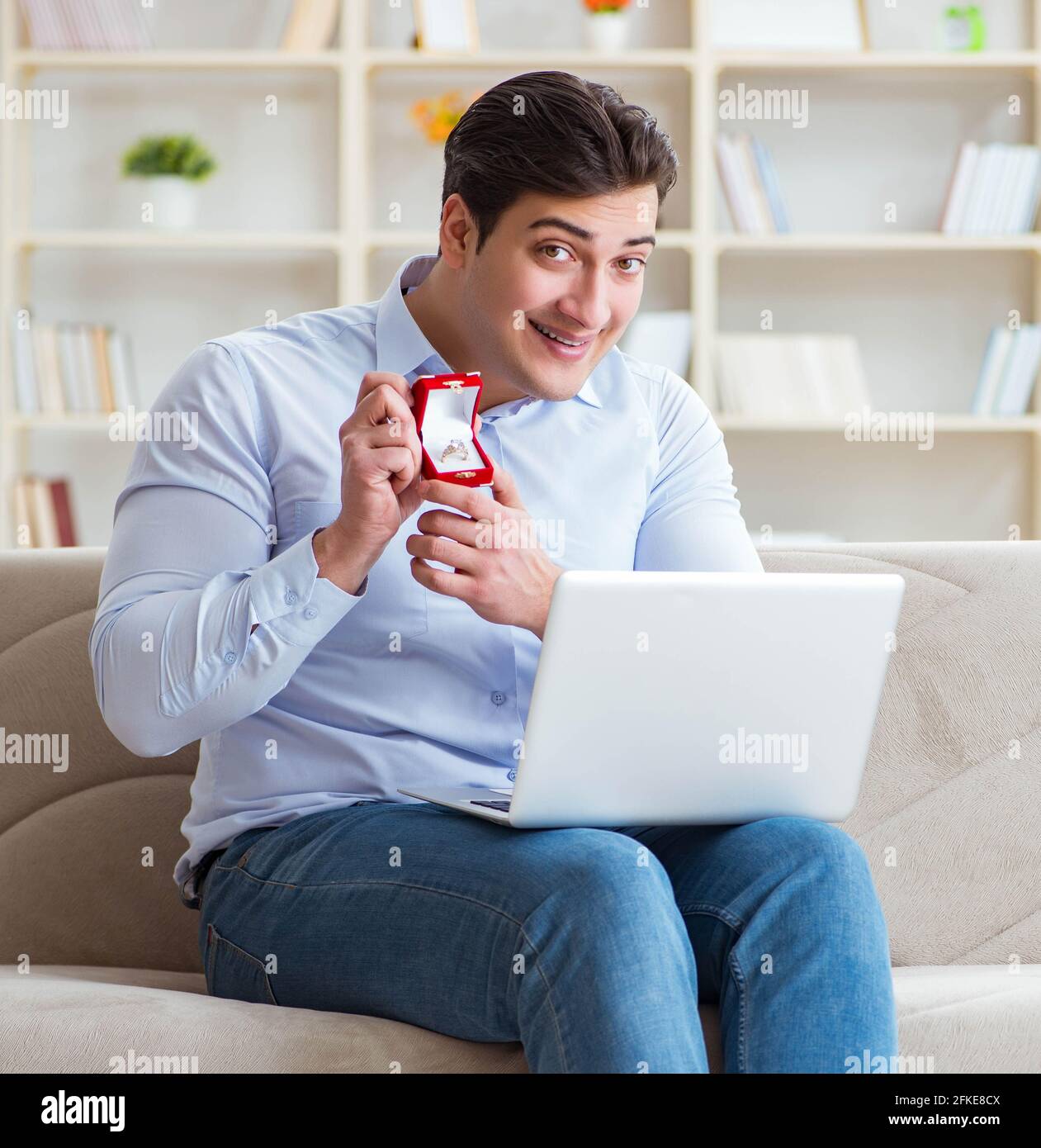 The young man making marriage proposal over internet laptop Stock Photo ...