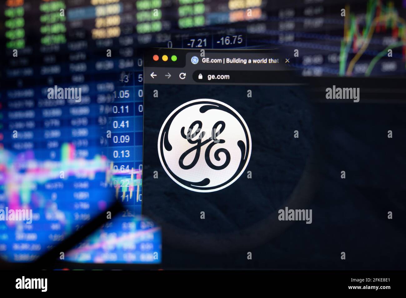 General Electric company logo on a website with blurry stock market ...