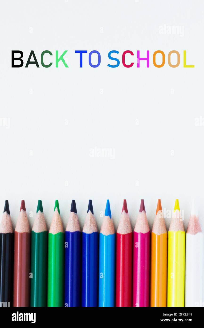 Back to school sign with colorful sharp pencils on white background ...