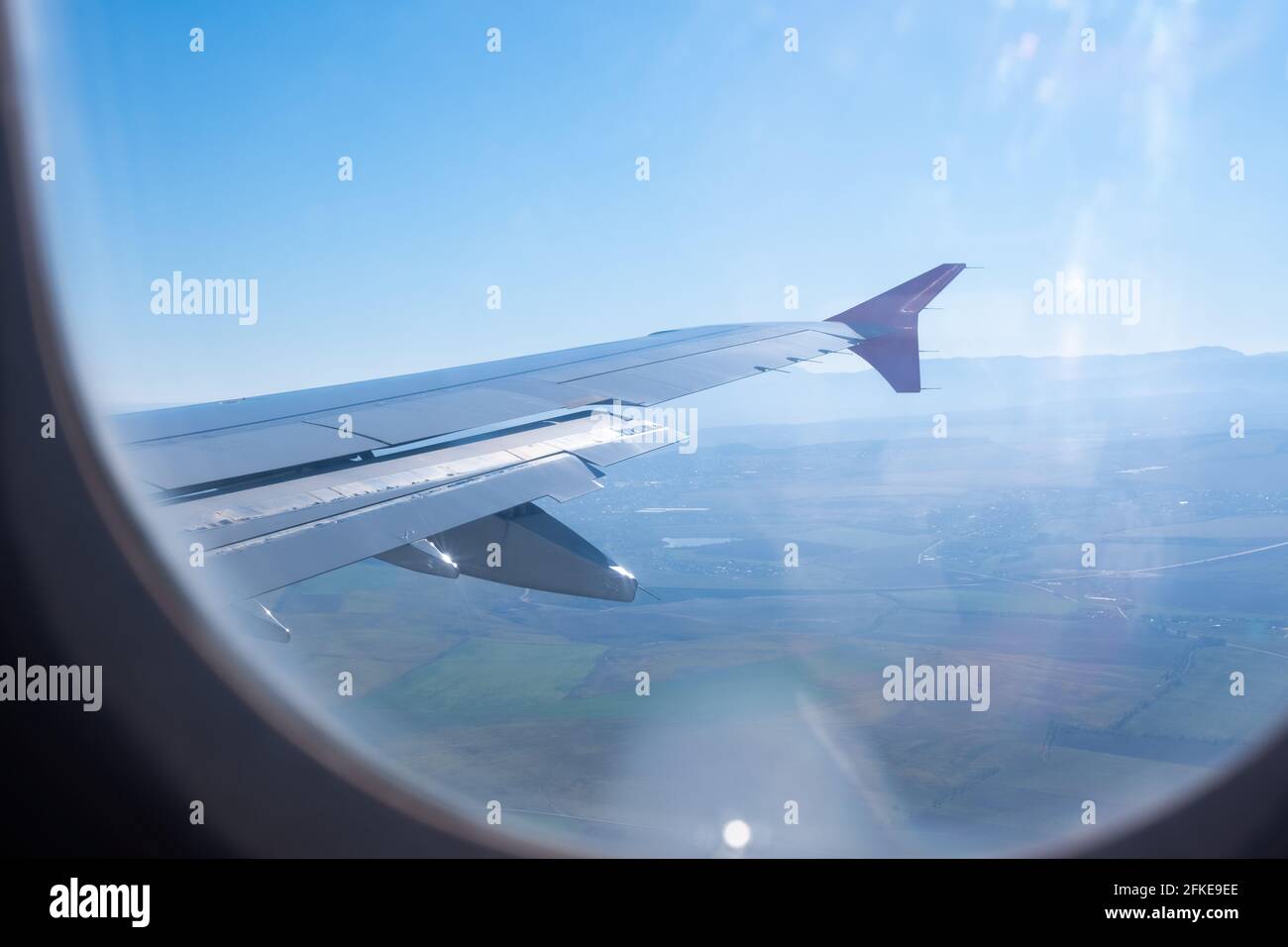airplane window picture with sun on the horizon Stock Photo - Alamy