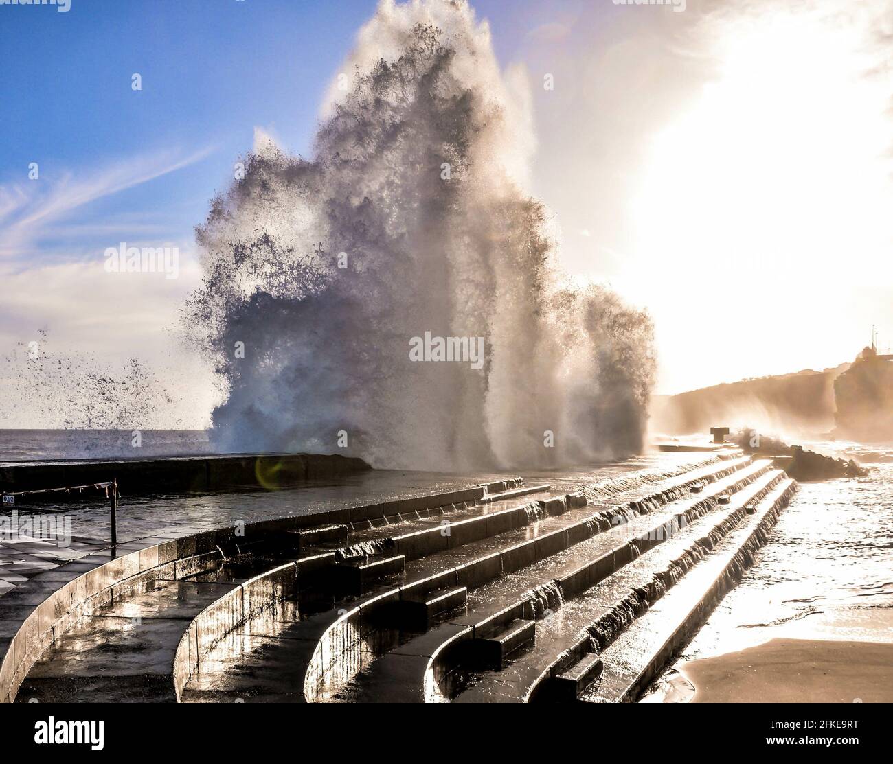 Big wave at the dam in the ocean Stock Photo - Alamy
