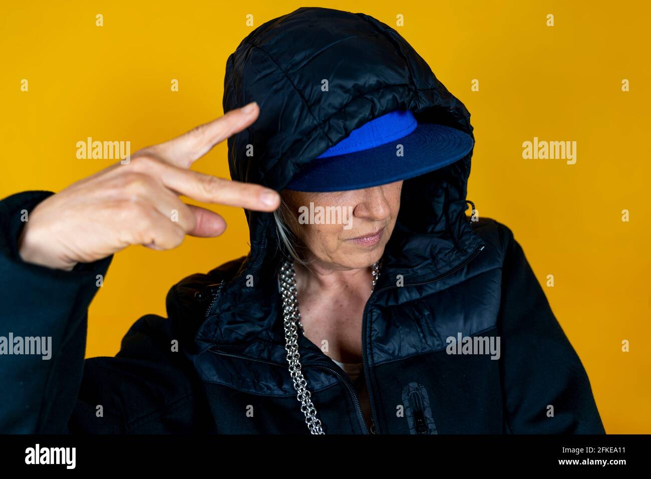 Funny portrait of mature woman. Lady having fun dressed as an angry ...