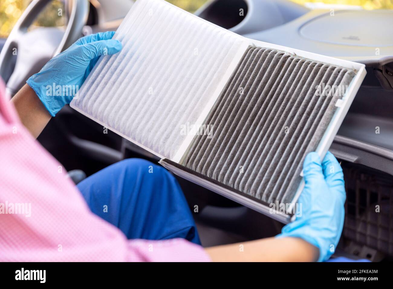 Replacement of cabin pollen air filter for a vehicle Stock Photo - Alamy