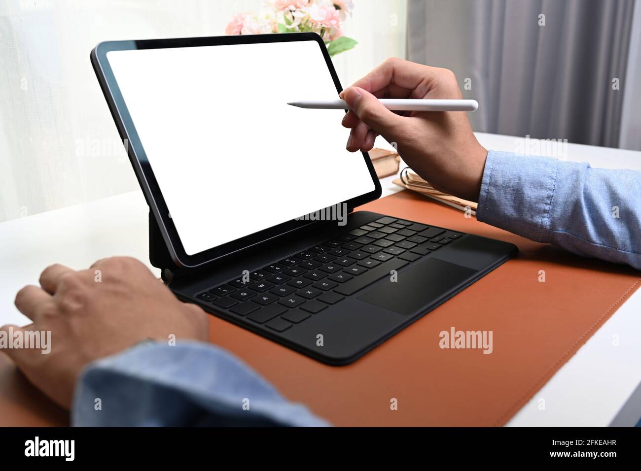 Close up view man holding stylus pen writing on empty screen of ...