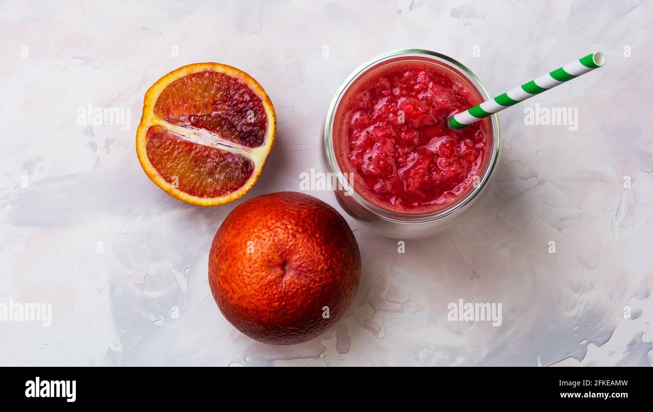 Red orange juice in a glass. Cocktail from Sicilian oranges. Creative ...