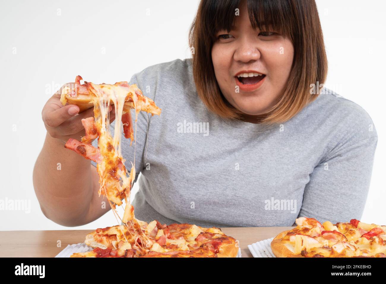 Hungry Overweight Woman Holding Pizza And Happy To Eat Pizza Concept