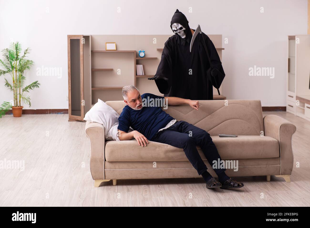 Devil coming to old dying man Stock Photo - Alamy