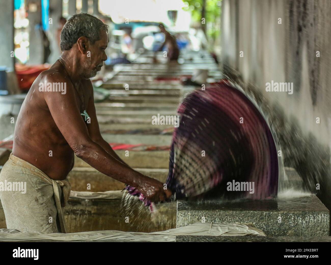 Colombo, Sri Lanka. 1st May, 2021. A Sri Lankan laundry worker washes ...