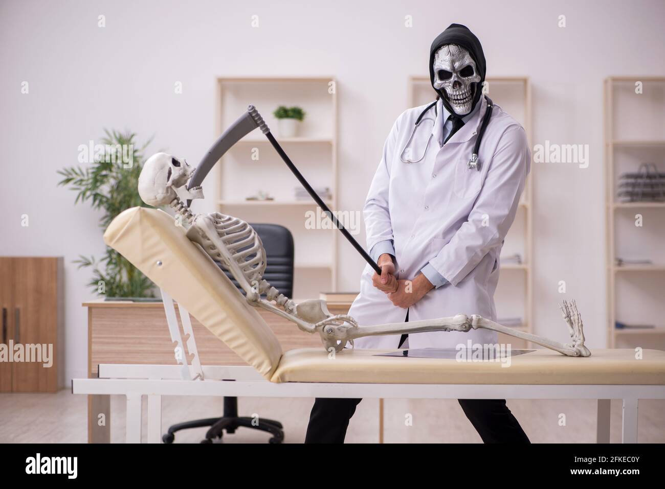 Reaper grim doctor examining skeleton patient in the clinic Stock Photo ...