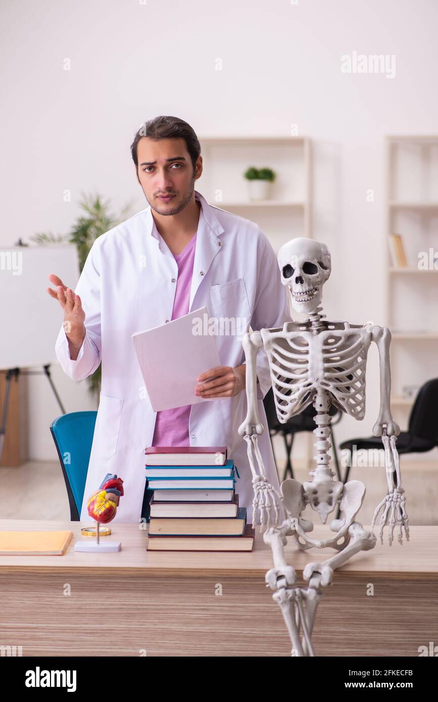 Young doctor student studying human skeleton in the classroom Stock ...